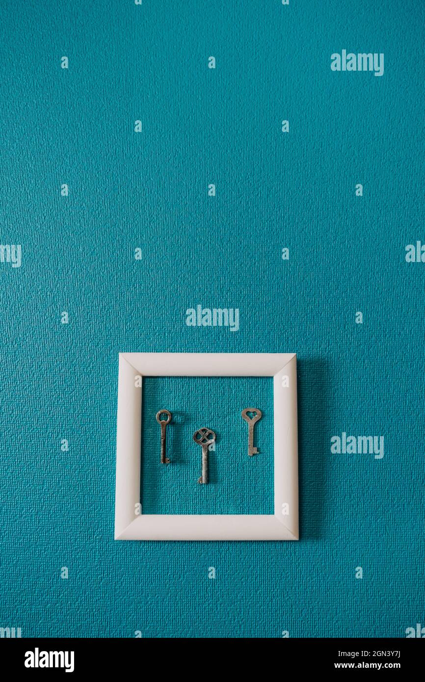 Key in frame on blue wall backgroung. Key new home, homeownership, keys ...