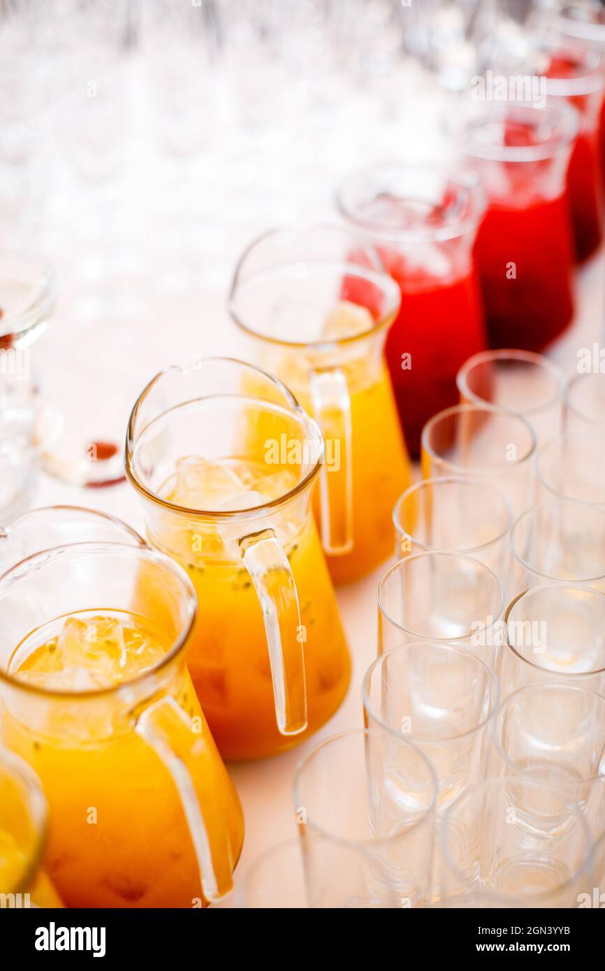 Different types of summer drinks in glasses, cubes of ice and slice of ...