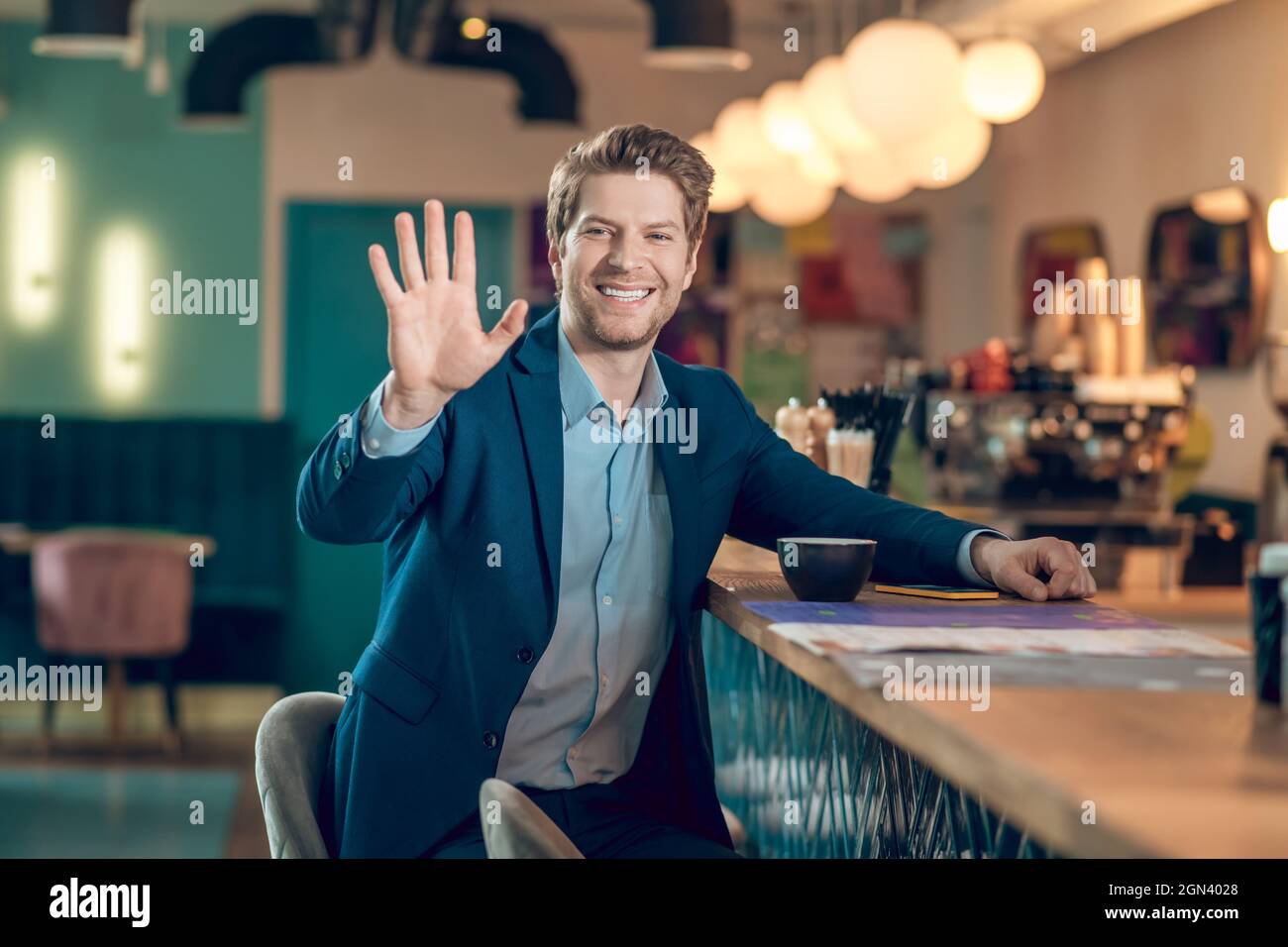 Man raising hand up hi-res stock photography and images - Alamy