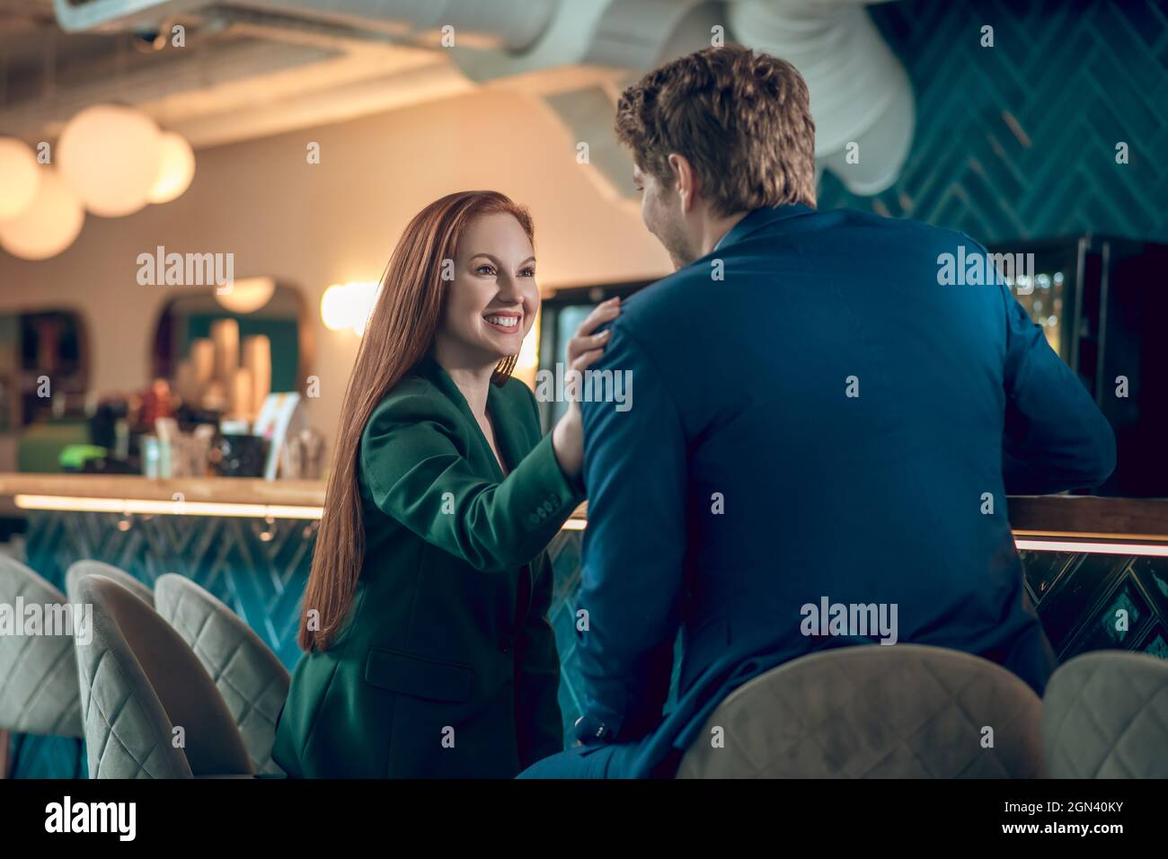 Woman touching shoulder red hi-res stock photography and images - Alamy