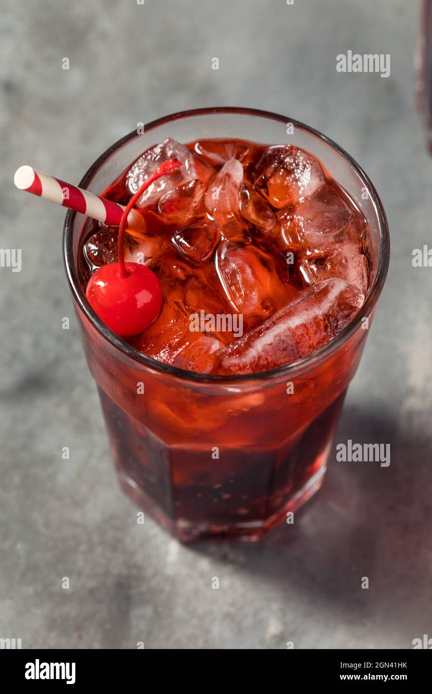 Cold Refreshing Cherry Cola in a Glass with Ice Stock Photo - Alamy