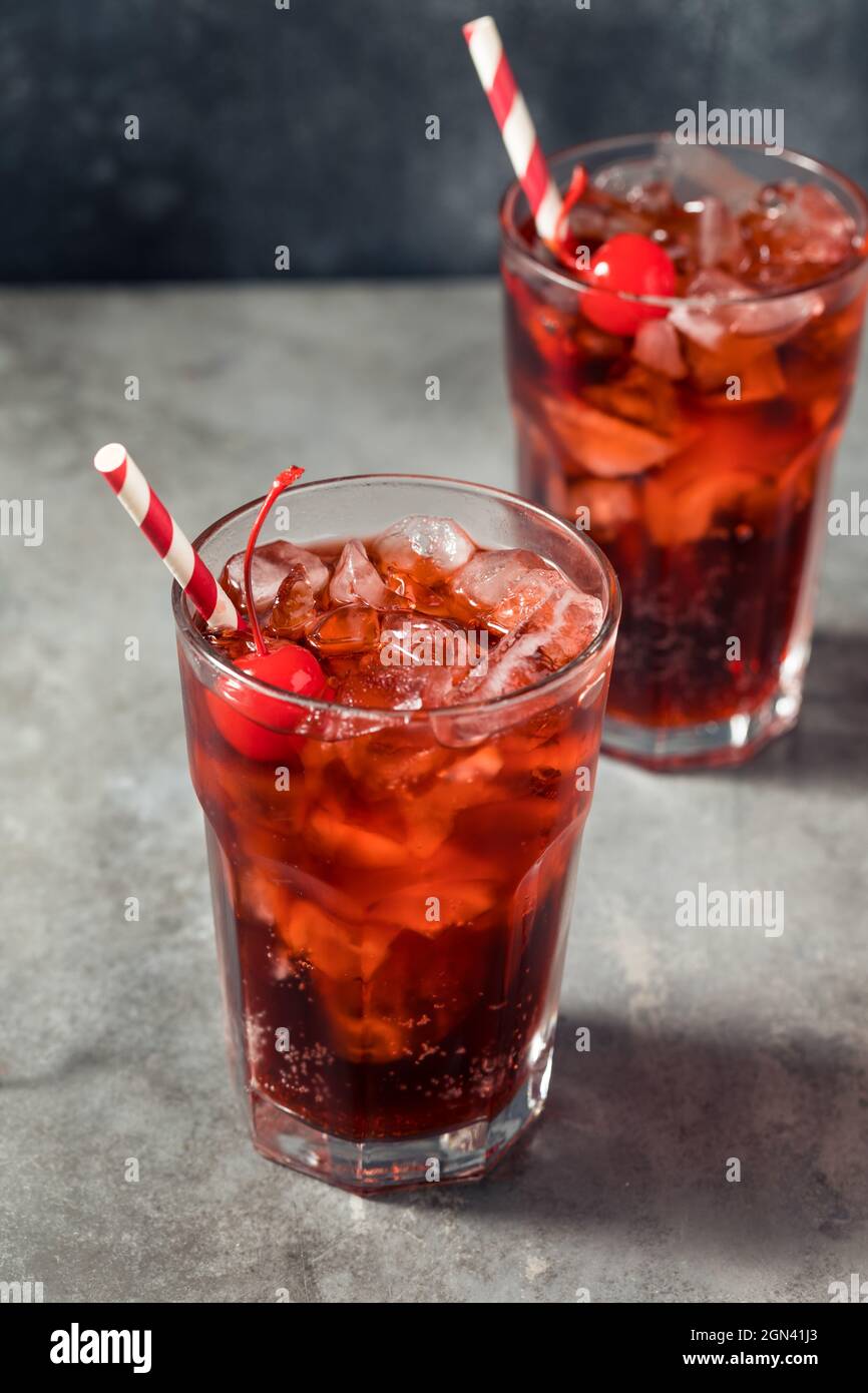 Cold Refreshing Cherry Cola in a Glass with Ice Stock Photo - Alamy