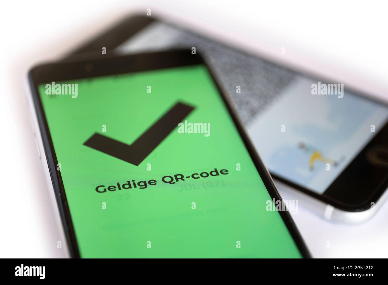 Dutch text "Valid QR code" on the green screen of a smartphone meaning ...