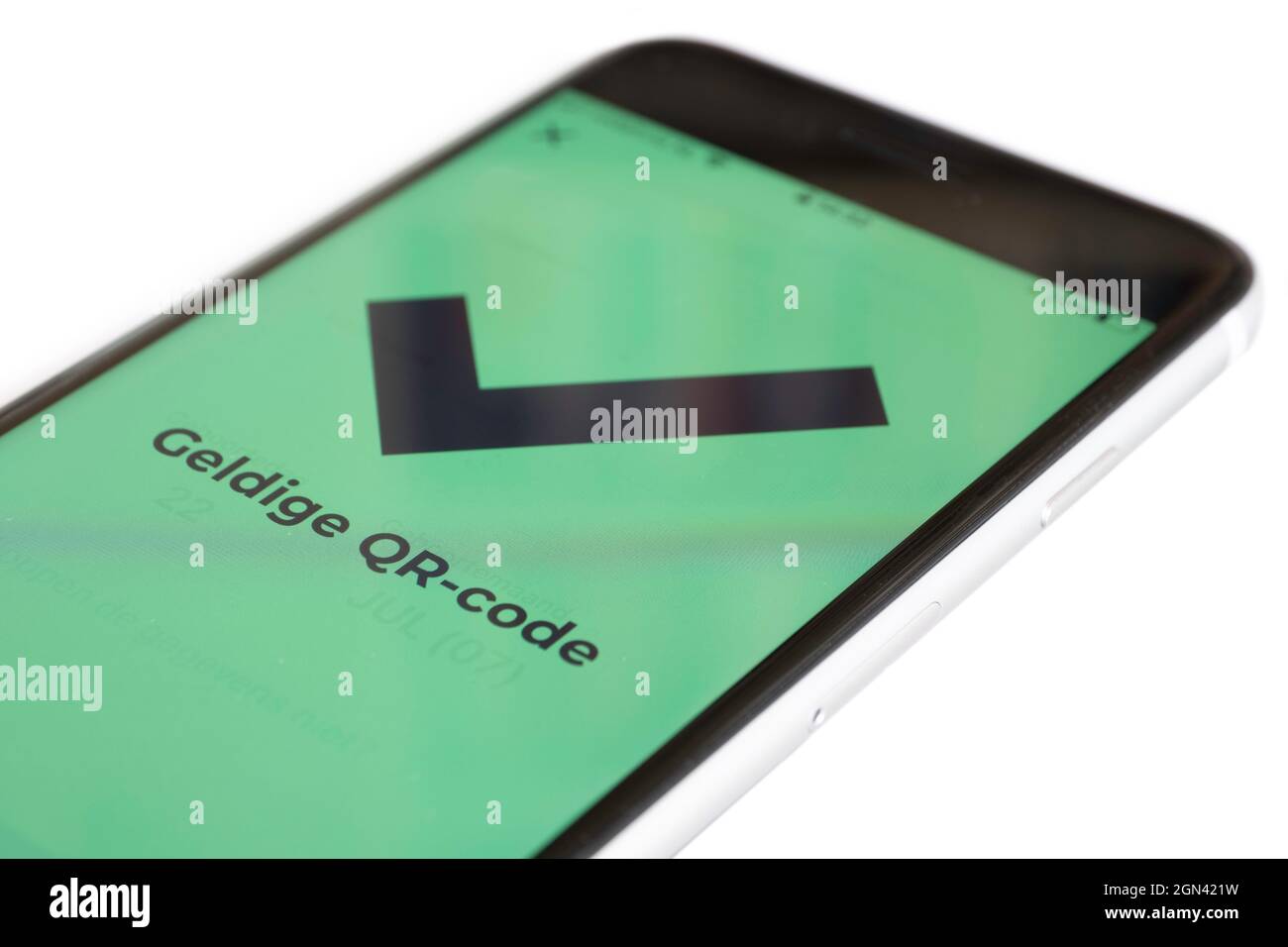 Dutch text "Valid QR code" on the green screen of a smartphone which ...