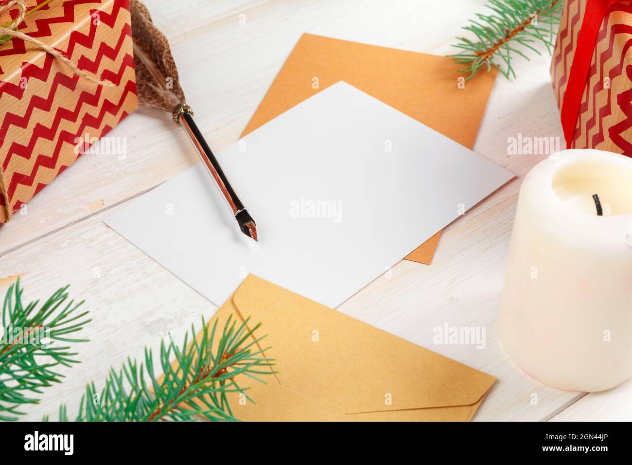 Top view of Christmas letter writing on yellow paper on wooden ...