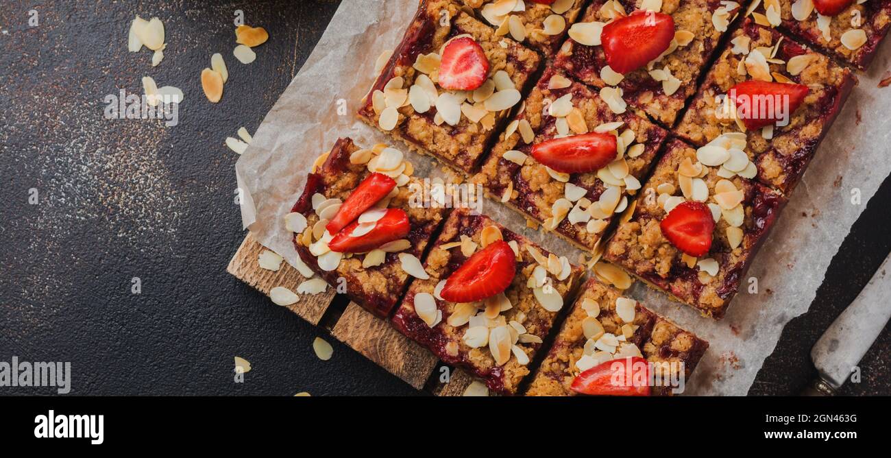 Dessert Squares with Strawberries and Oat Streisel on dark old baking ...