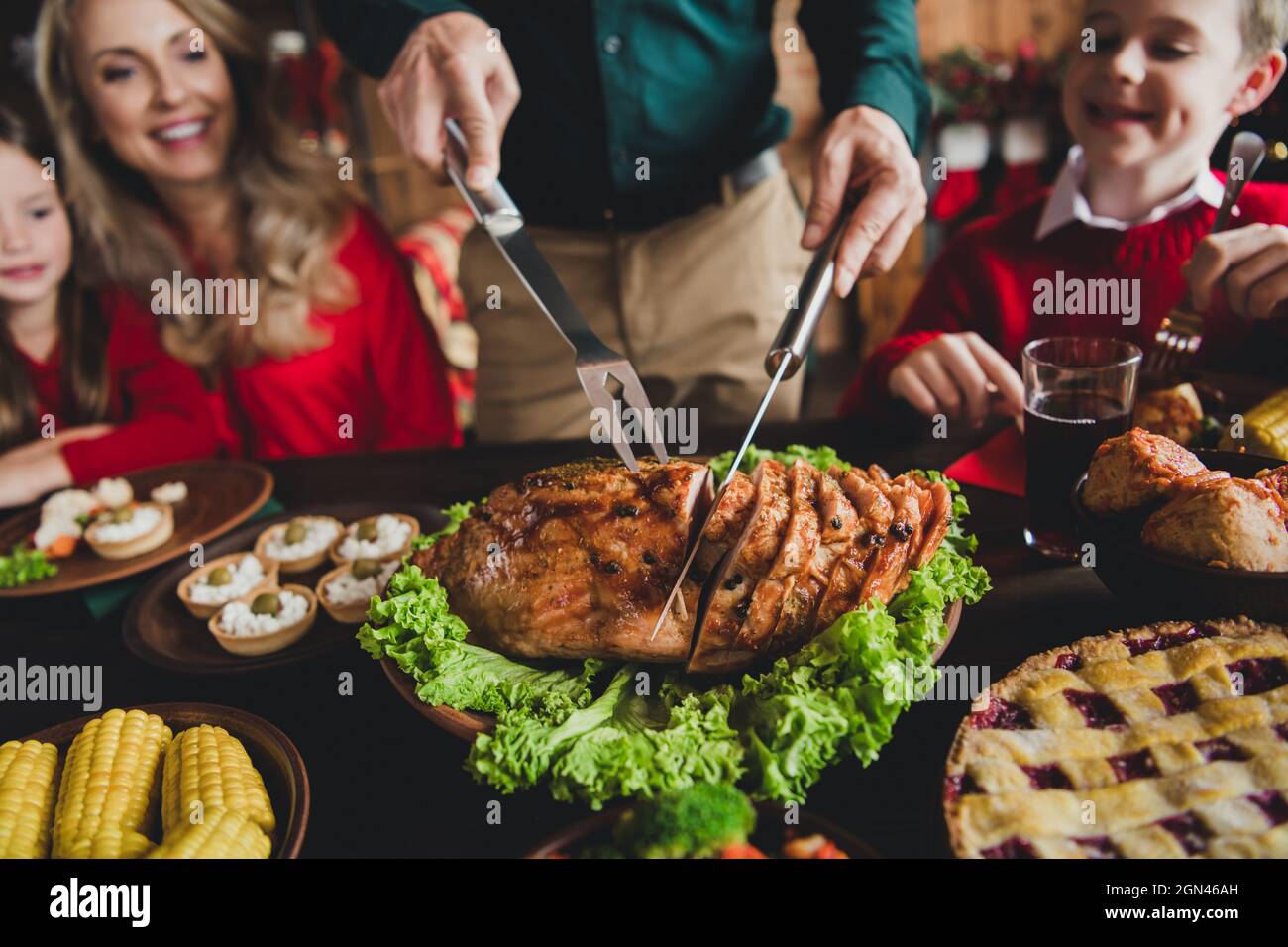 Portrait of attractive cheerful family gathering eating fresh delicious ...
