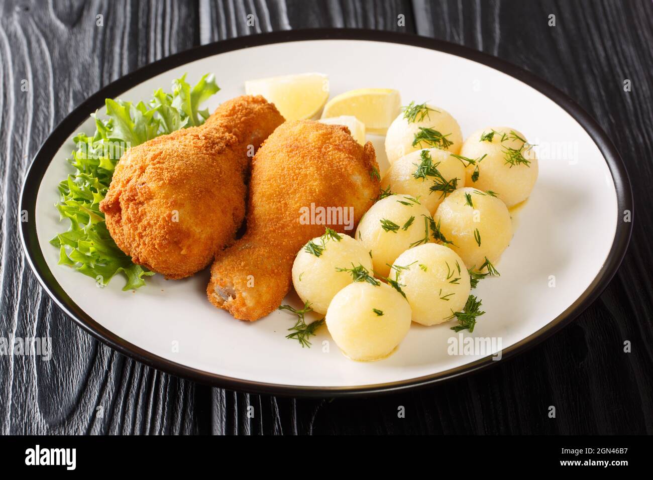 Vienna Style Backhendl Breaded Fried Chicken leg with lemon and new ...