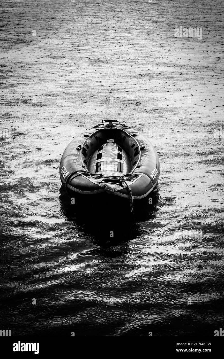 Grayscale boat in lake Stock Photo - Alamy