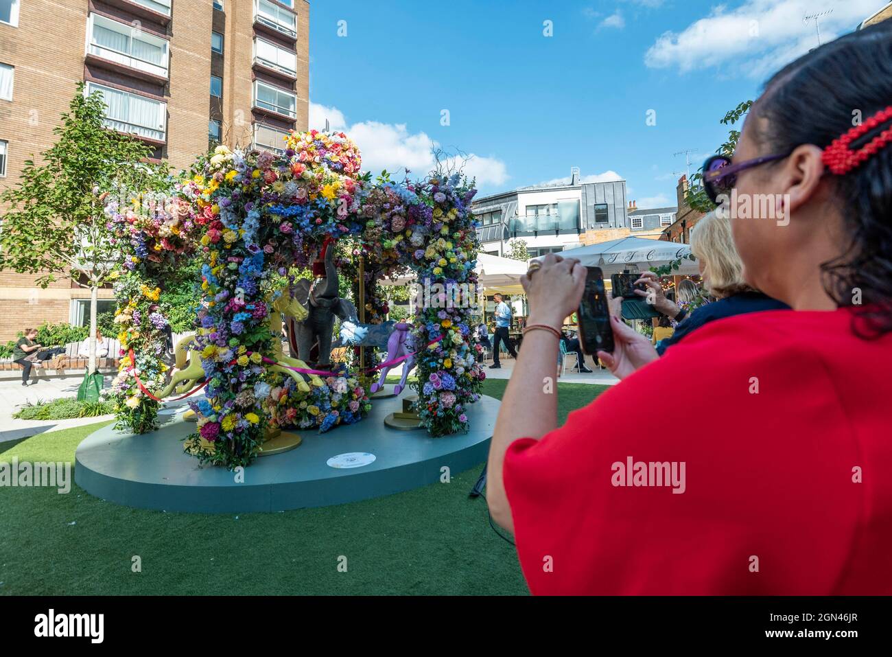 London, UK. 22 September 2021. A flower installation in Halkin Arcade ...