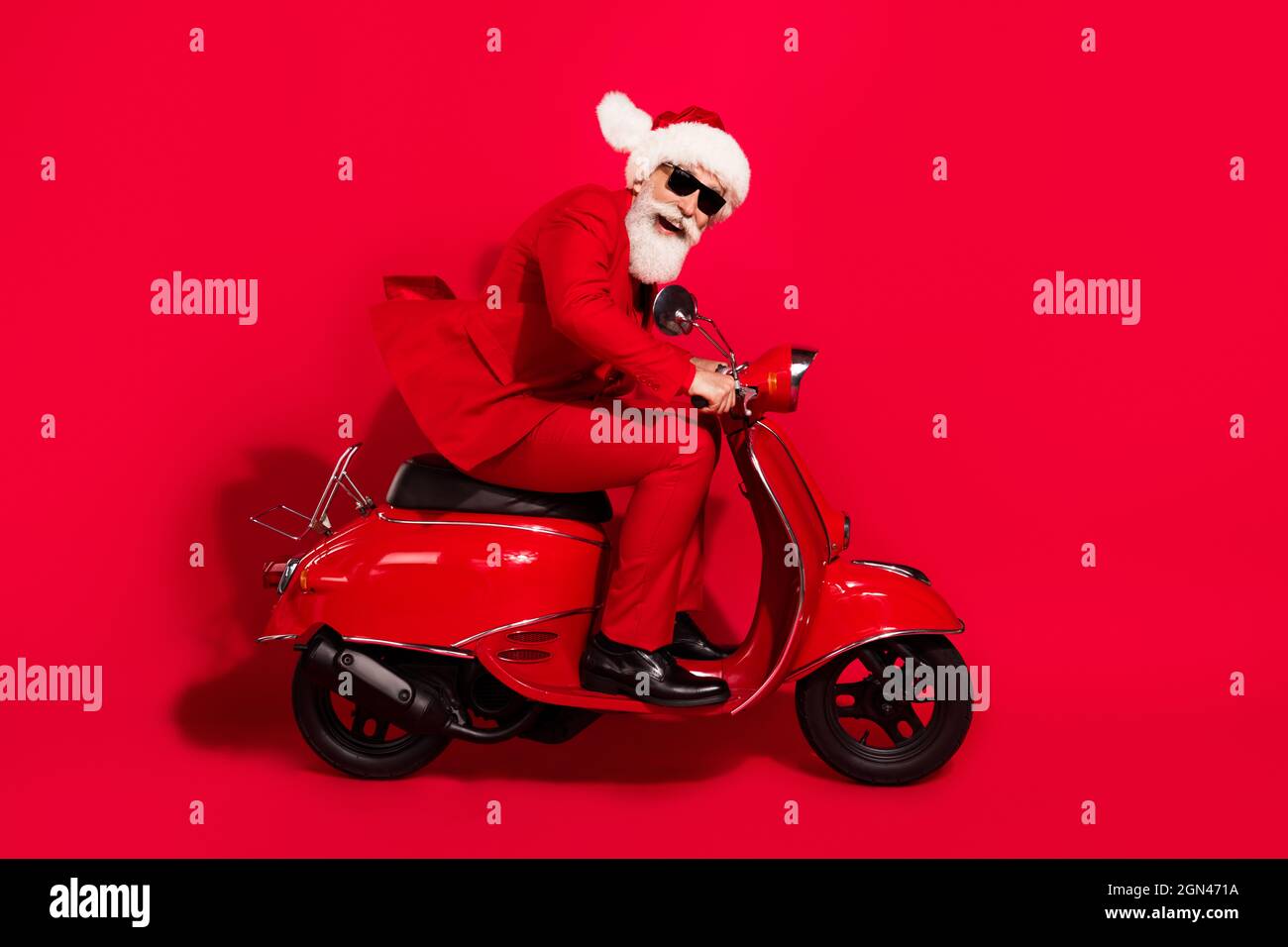 Photo of charming funky mature motorcyclist dressed christmas costume ...