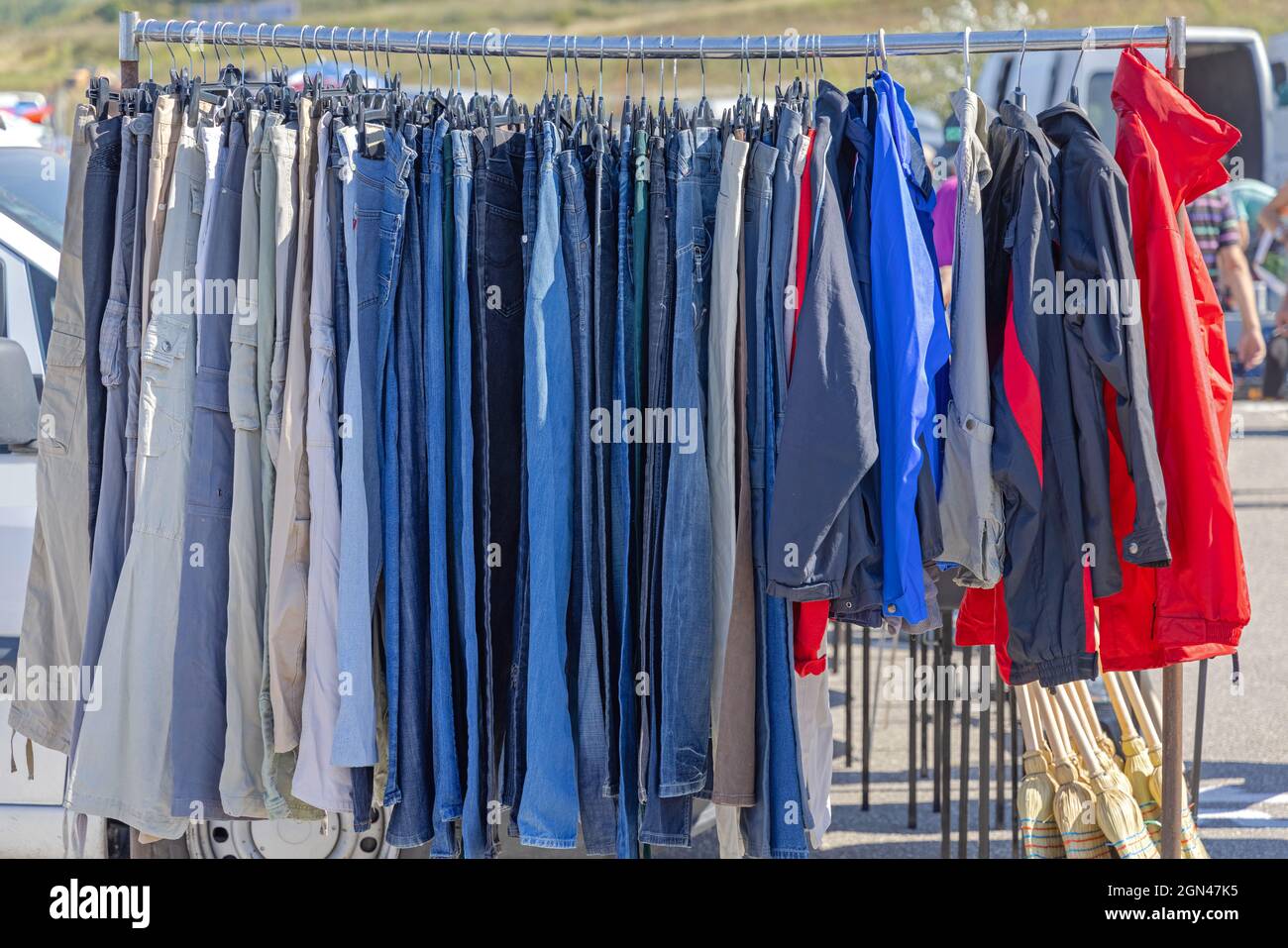 Jackets and Pants Garment for Sale at Flea Market Stock Photo - Alamy
