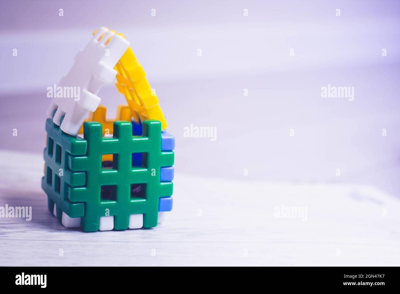 Toy house close up. Multi-colored toy dwelling. A hut made of details ...