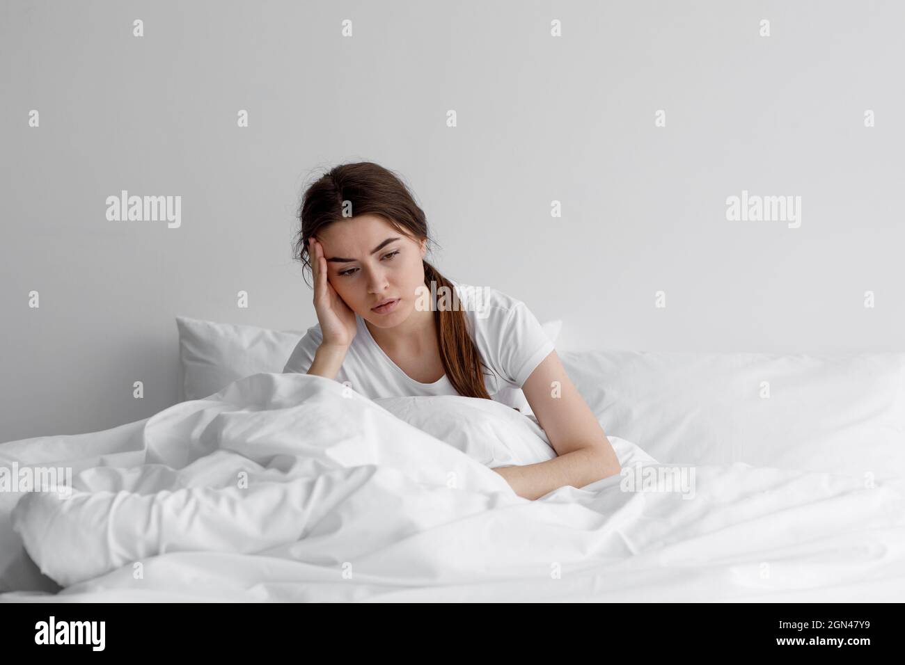 Sad european millennial female, worried, suffers from insomnia and ...