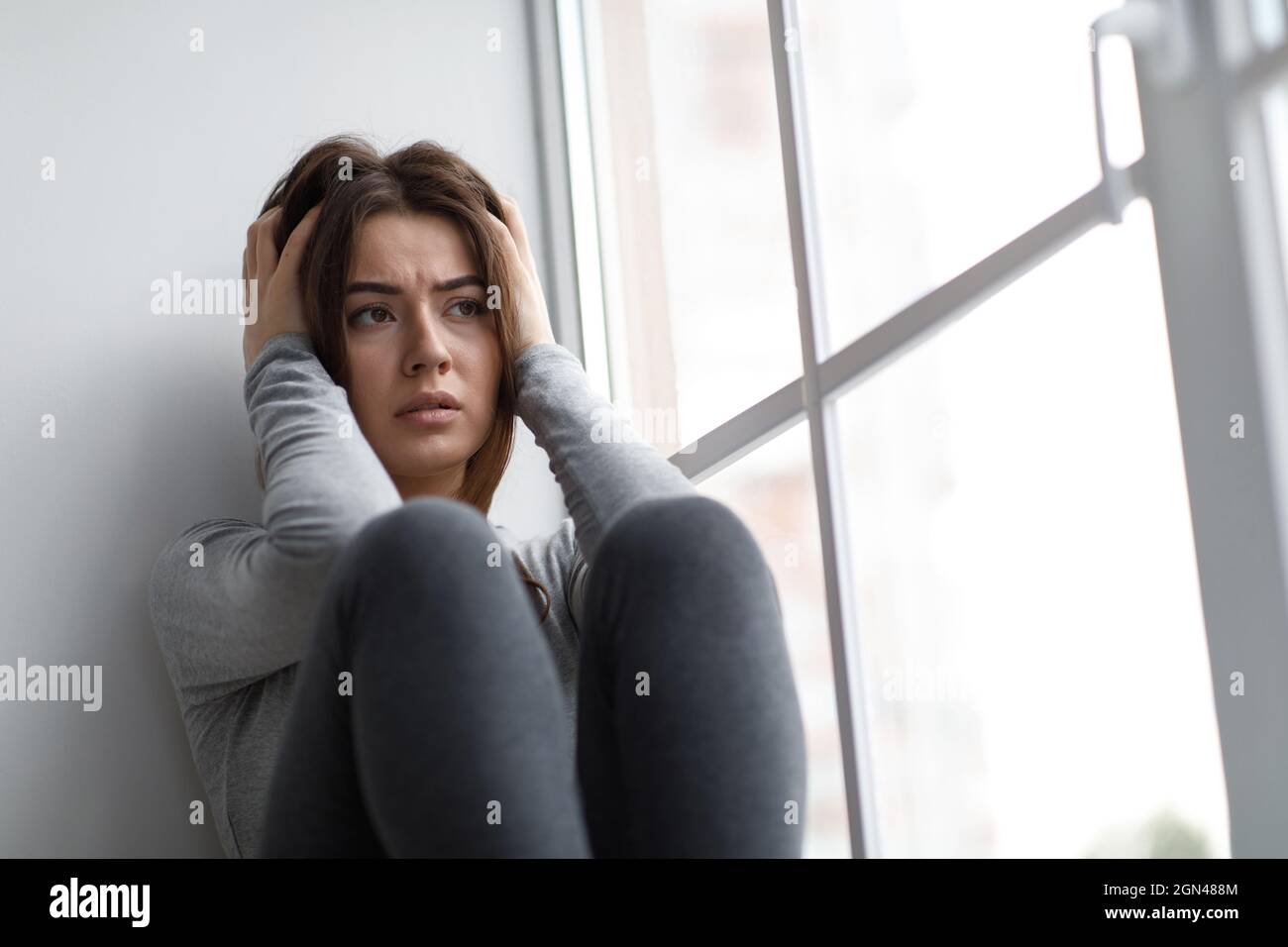 Despaired sad european millennial woman suffering from depression and ...