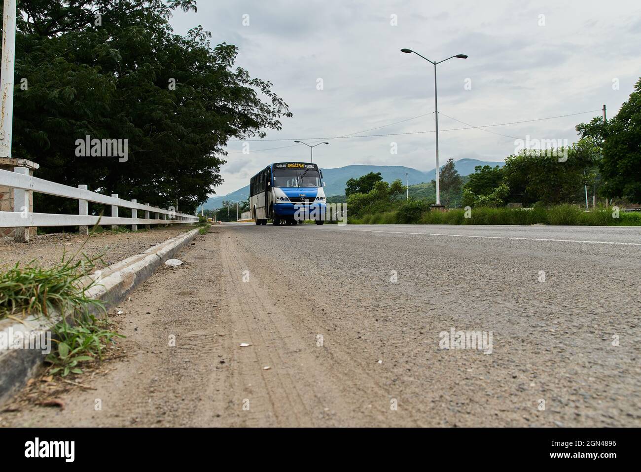 Urban truck for moving people in rural areas crossing Stock Photo - Alamy