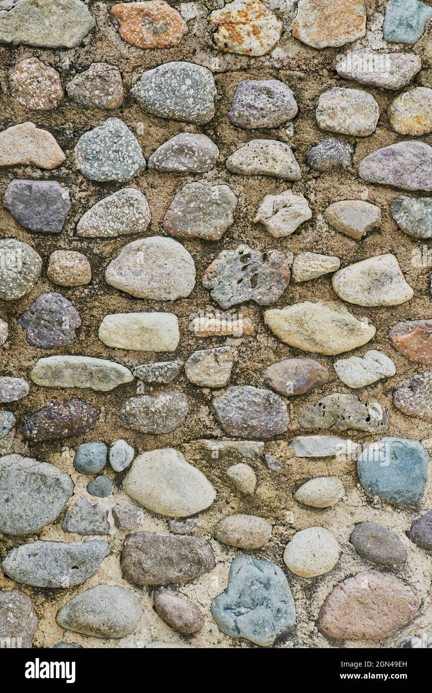 Tidy inlaid stone wall forming a decorative Stock Photo - Alamy