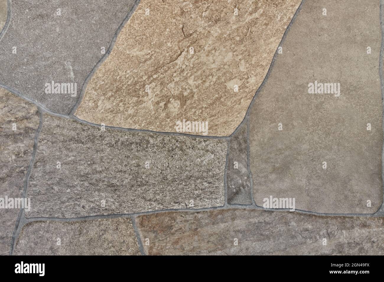 Tidy inlaid stone wall forming a decorative Stock Photo - Alamy