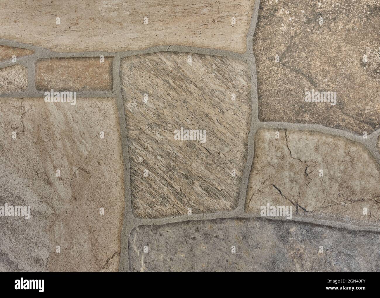 Tidy inlaid stone wall forming a decorative Stock Photo - Alamy