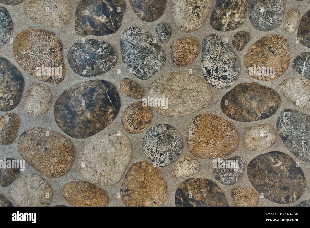 Tidy inlaid stone wall forming a decorative Stock Photo - Alamy