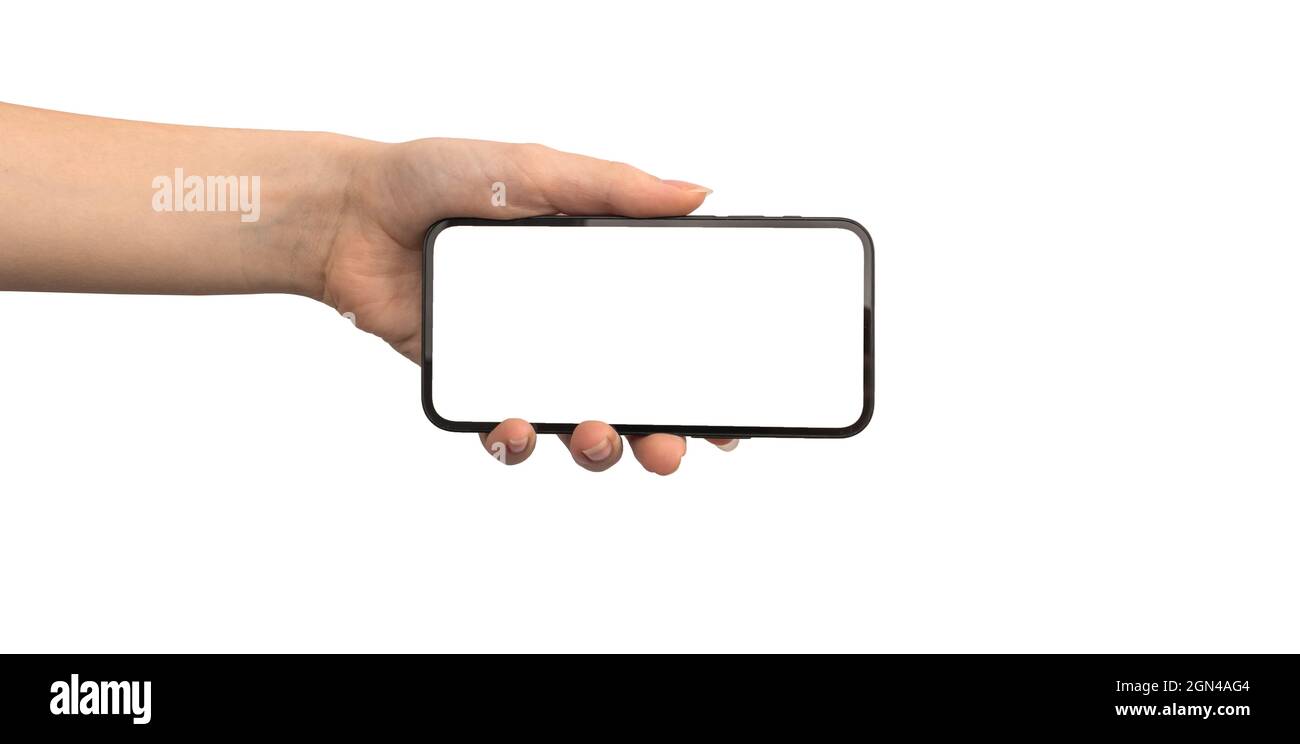 Hand holding mobile phone with horizontally screen mockup isolated on a ...