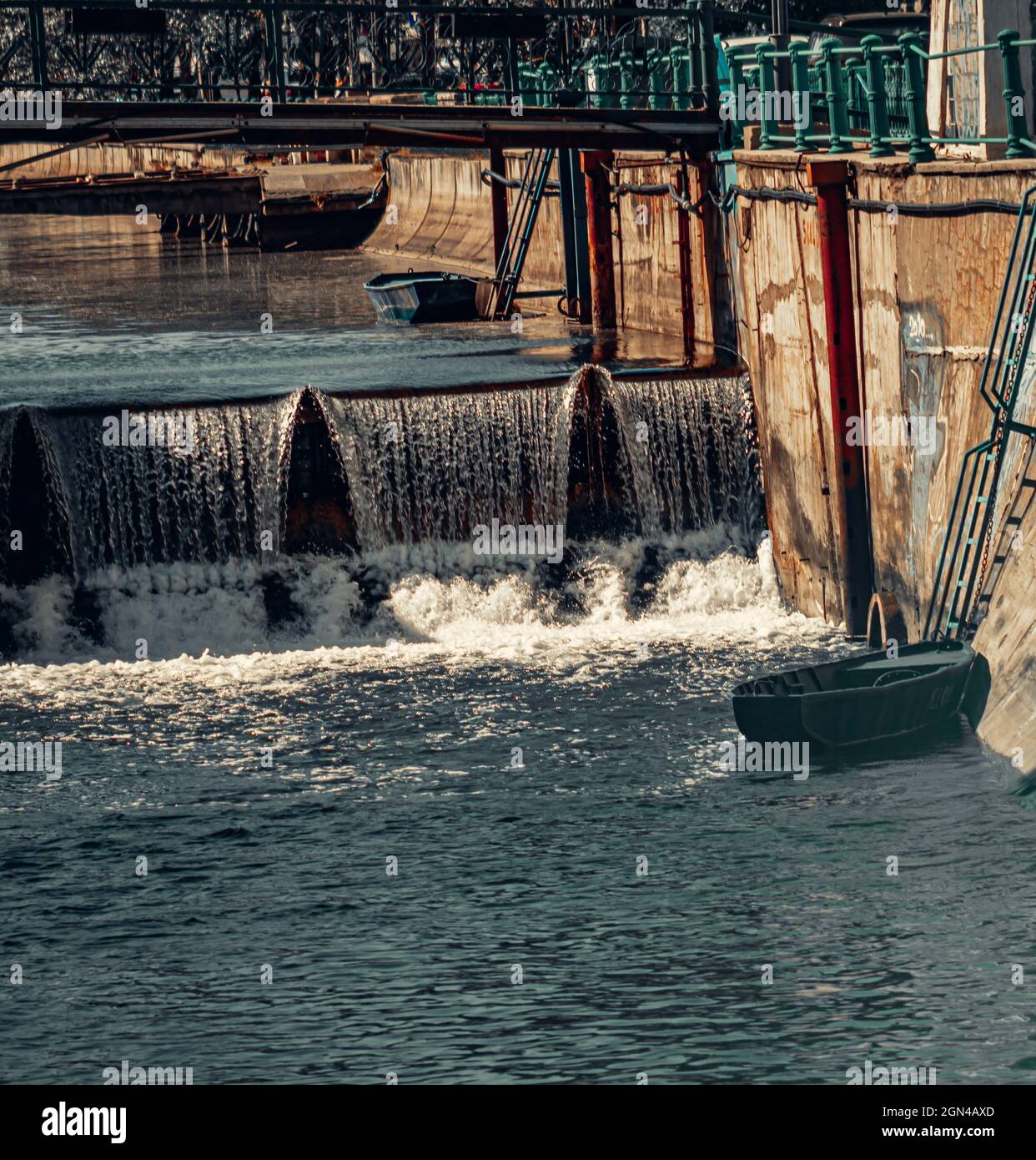 Dam sluice with flowing water Stock Photo - Alamy
