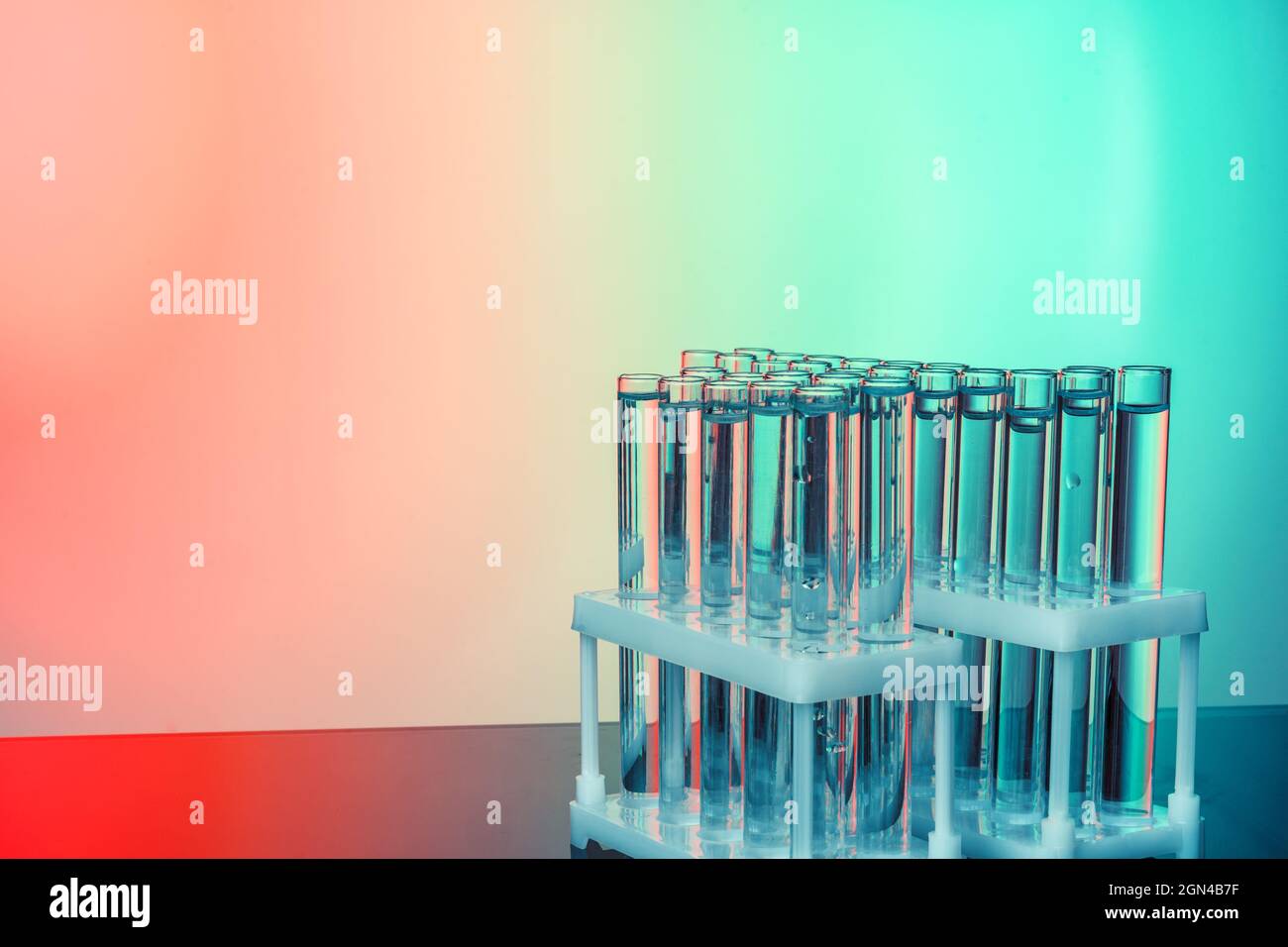 Row of test tubes with liquids on blue and green toned background Stock ...