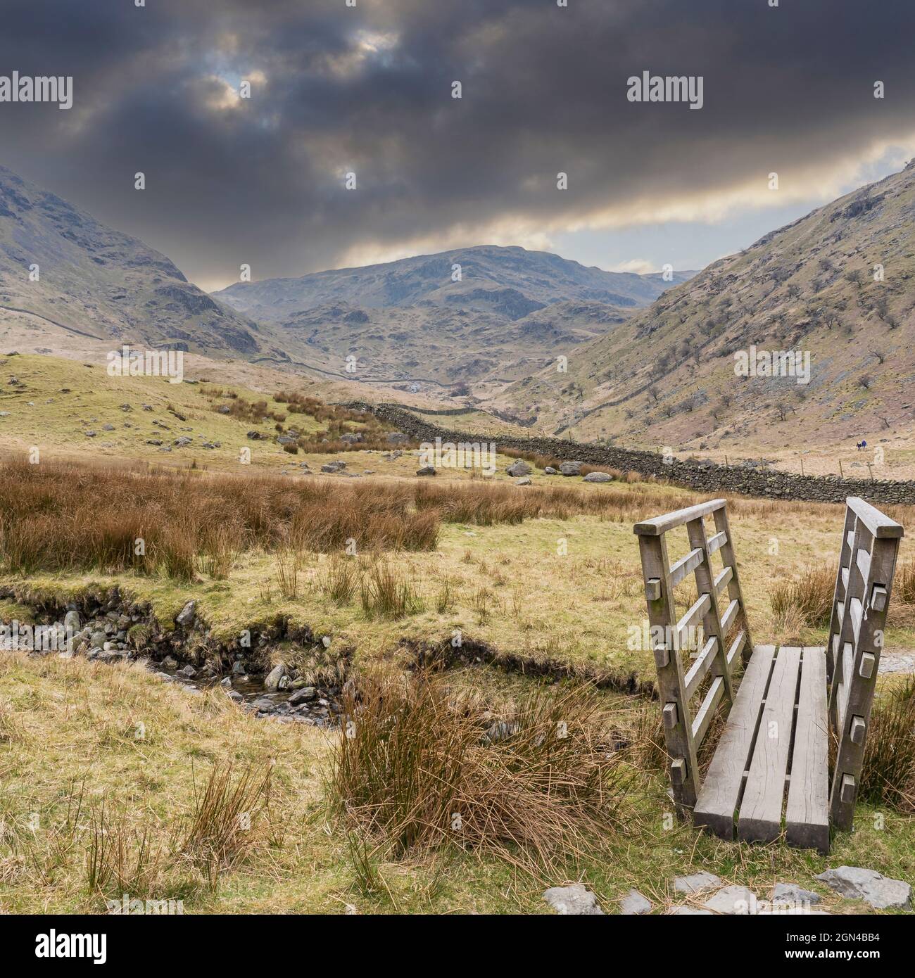 footbridge at head of haws water, cumbria, uk Stock Photo - Alamy