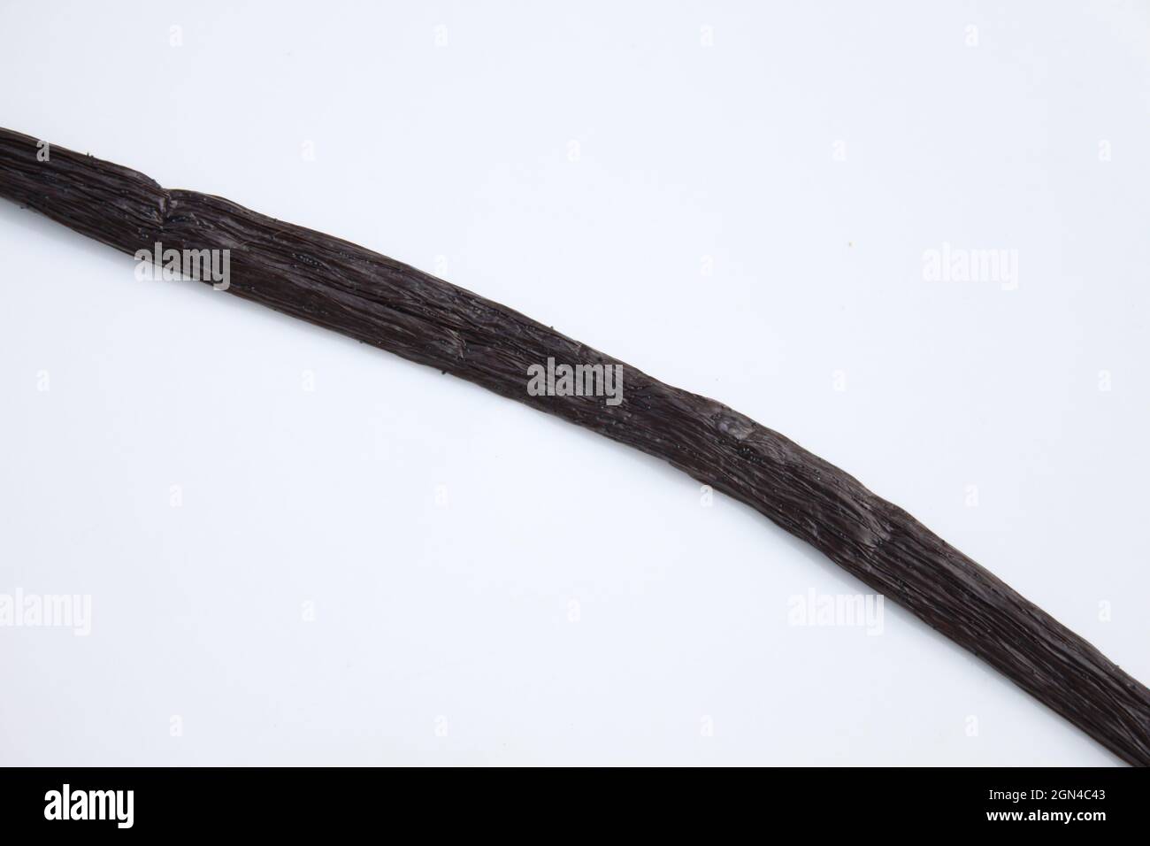 Dried vanilla bean isolated on white background Stock Photo - Alamy