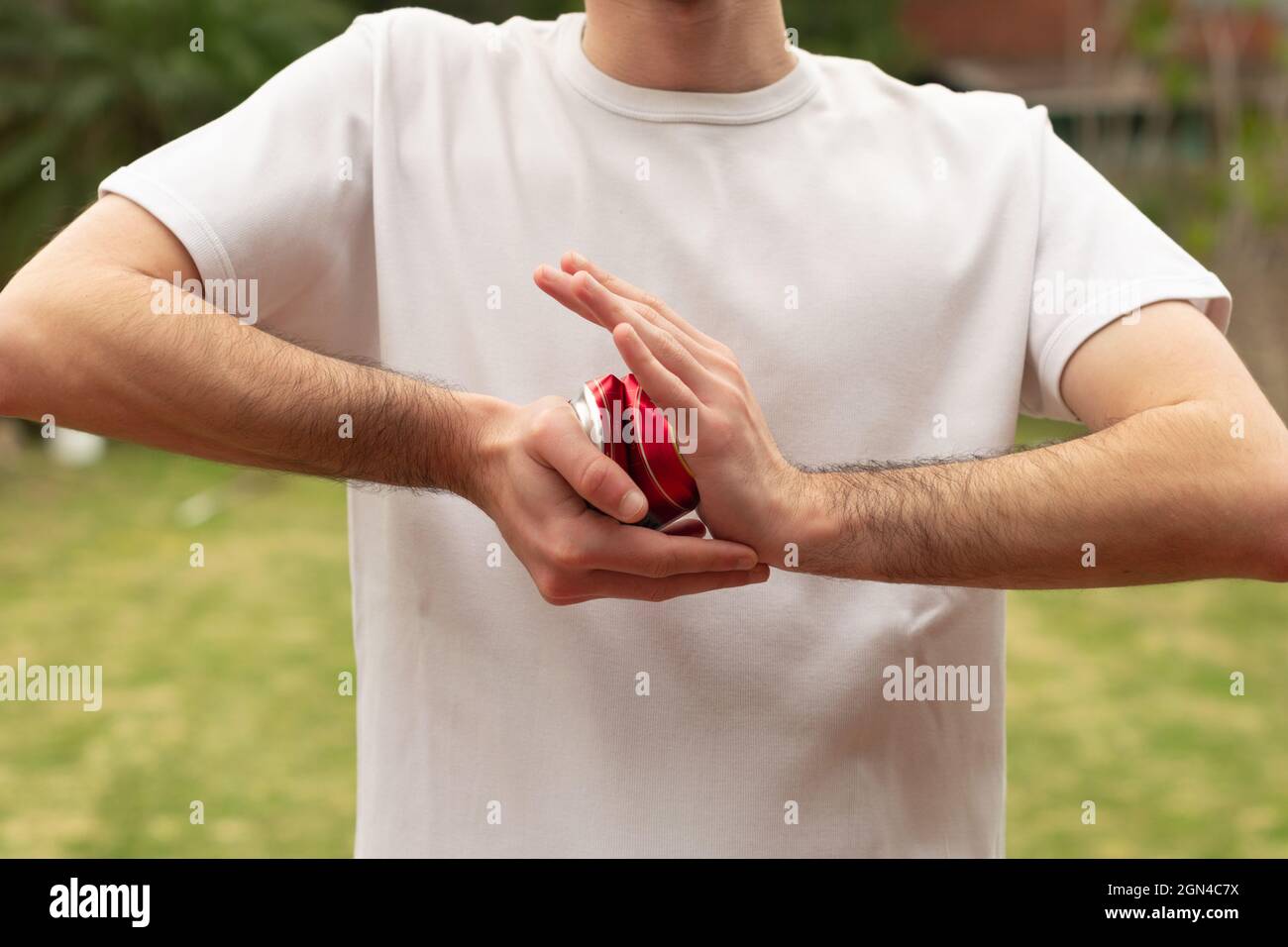 Hands squeezing a can Stock Photo - Alamy