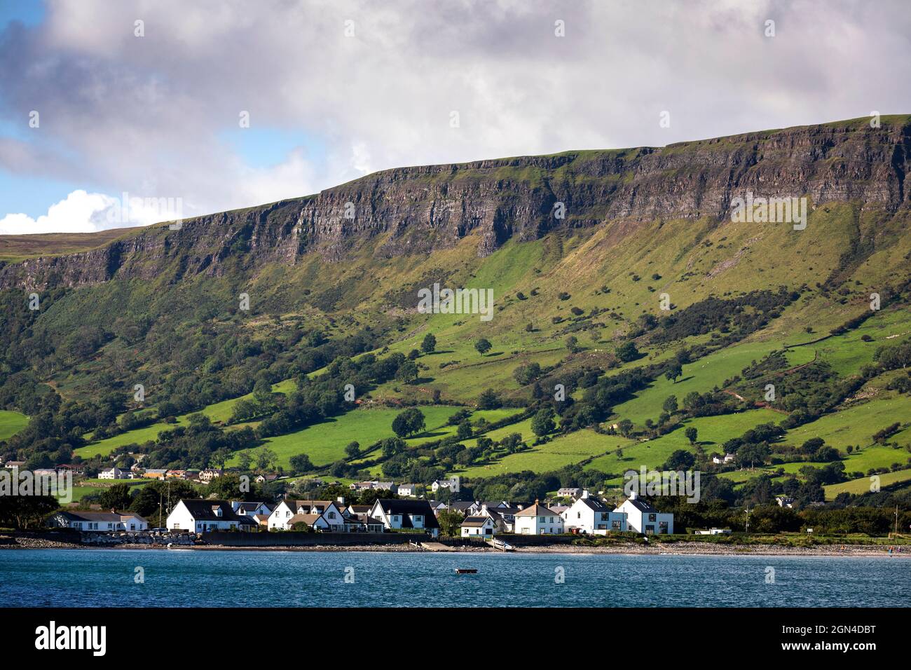 Waterfoot and the Antrim Plateau behind Stock Photo - Alamy