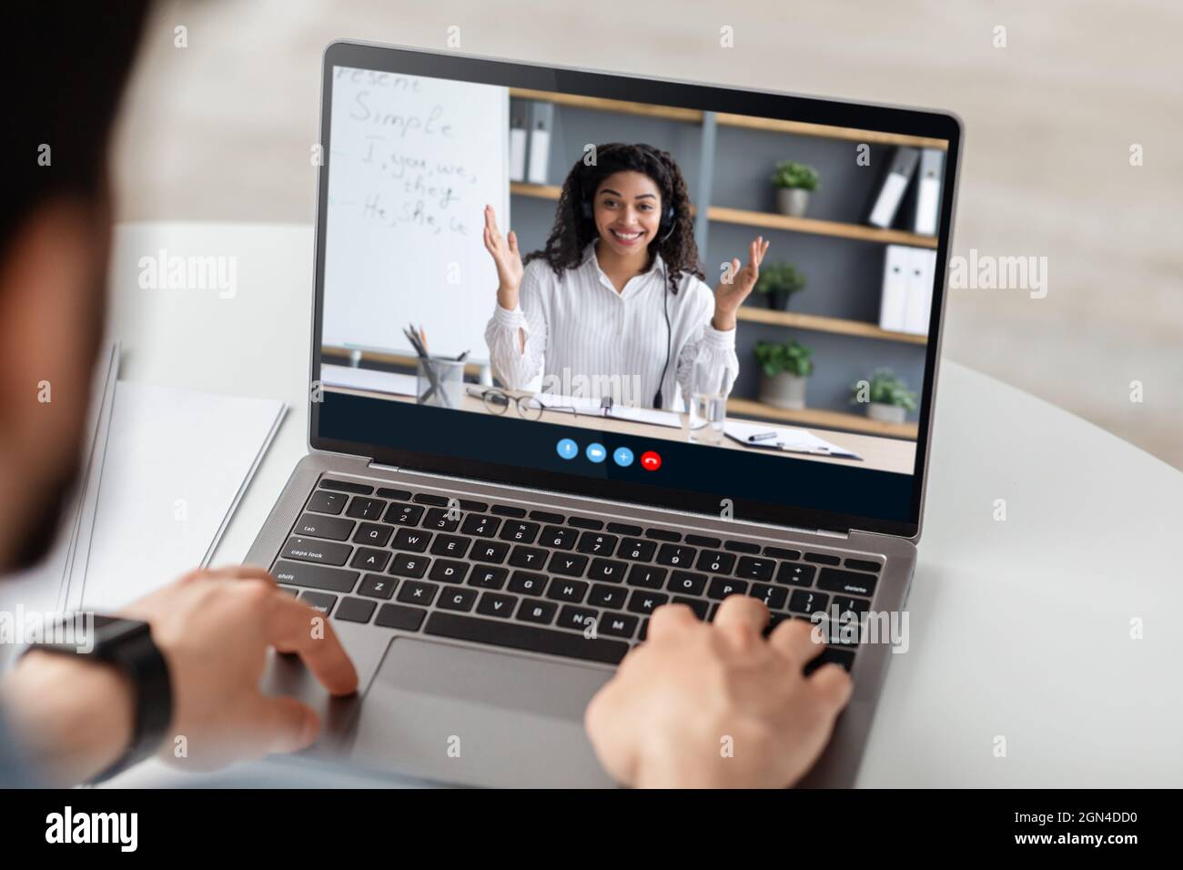 Friendly millennial afro american lady teacher explains rules to young ...