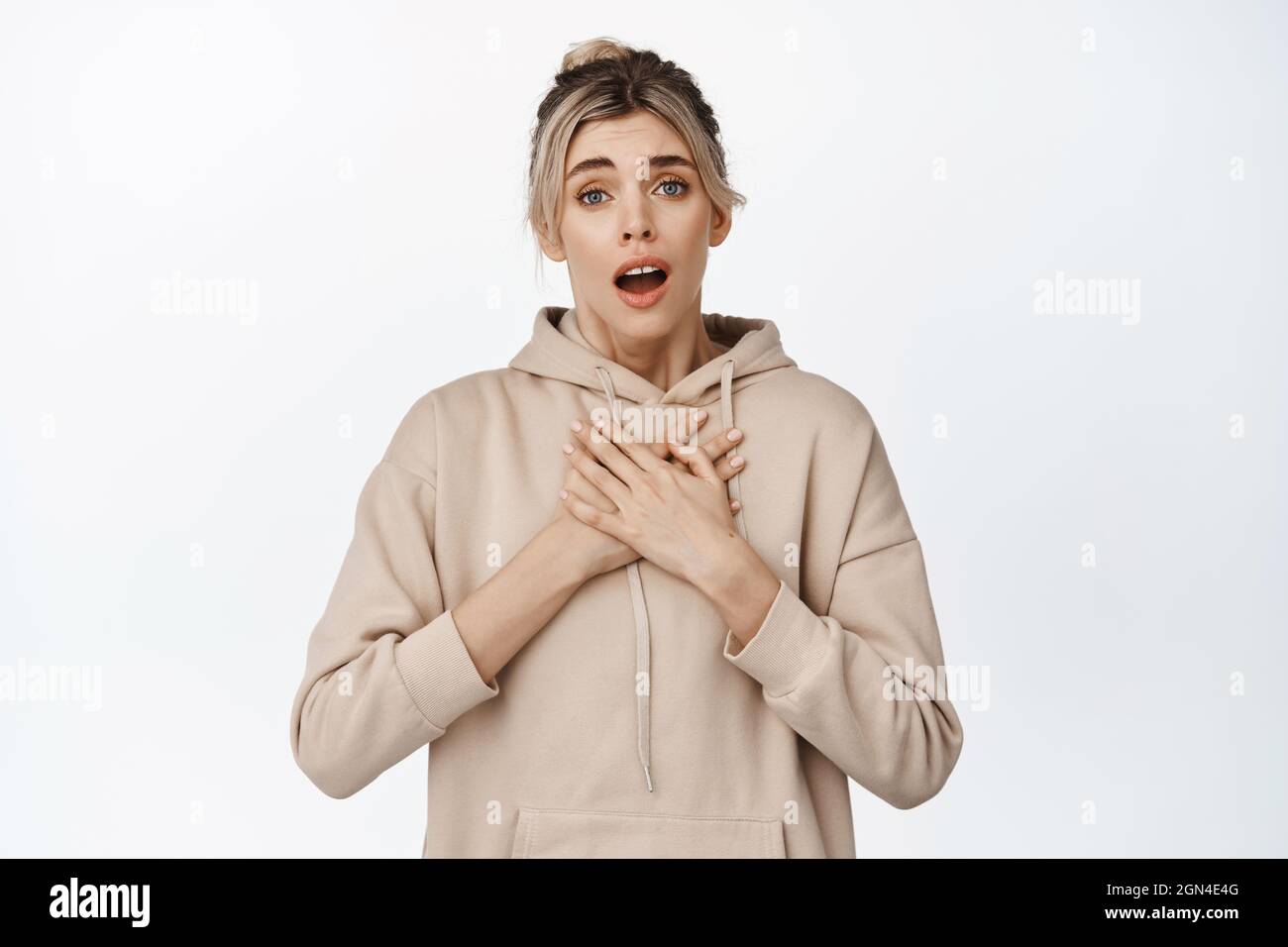 Image of emotional young woman, gasping affectionate, feeling touched ...