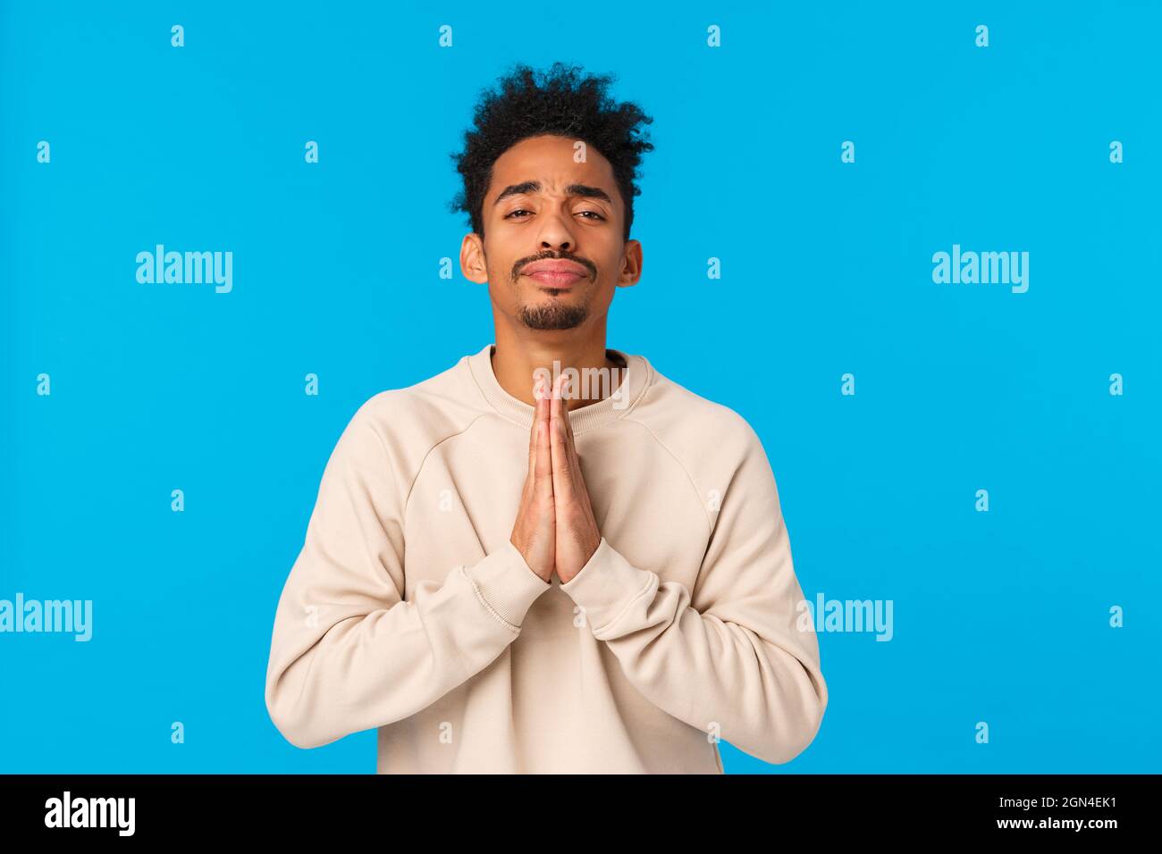 Man pleading for help. Cute and sad african-american guy with moustache ...