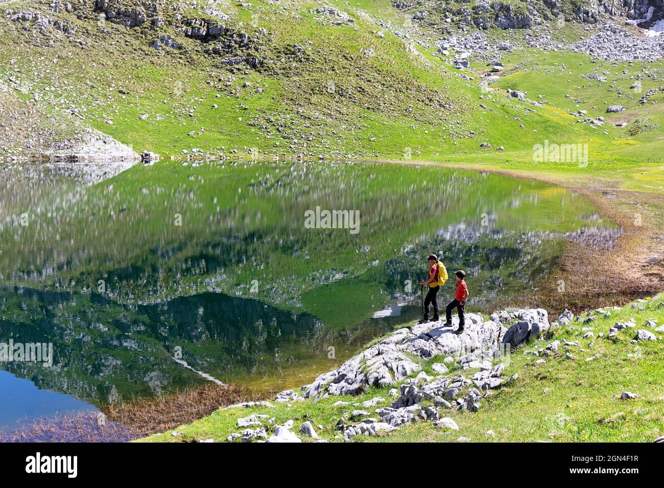 mother and son on a hiking trip to beautiful manito lake close to ...