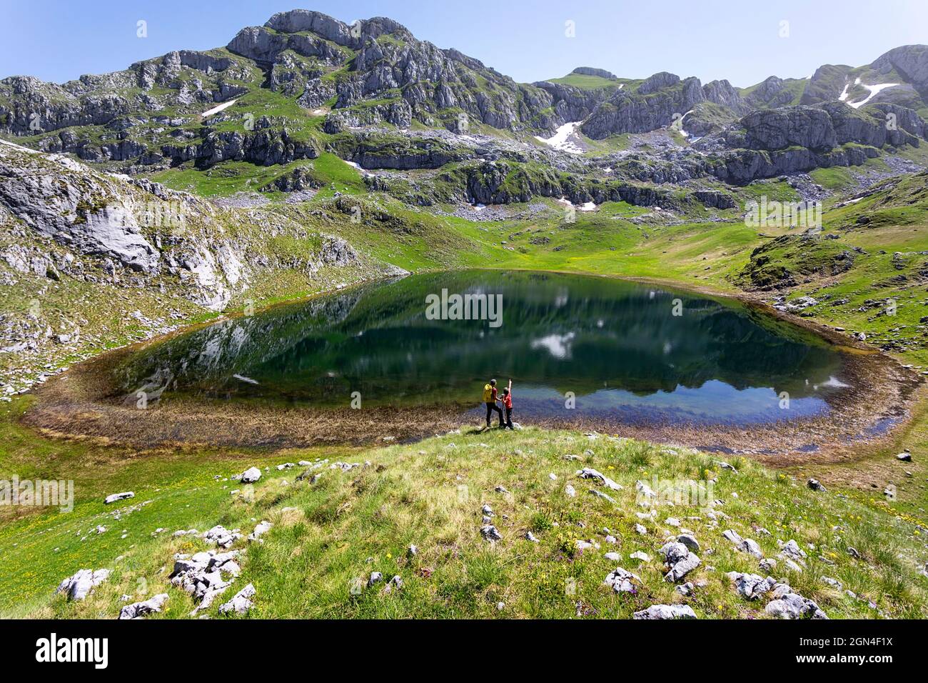 Mother and son looking at the beautiful alpine manito lake close to ...