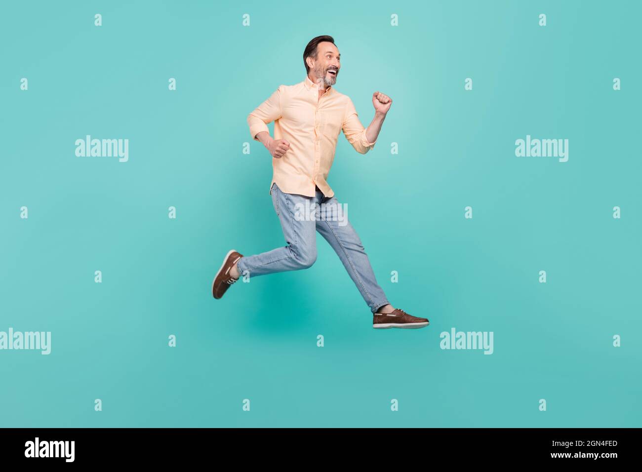 Full size profile side photo of smiling man running fast speed in air ...