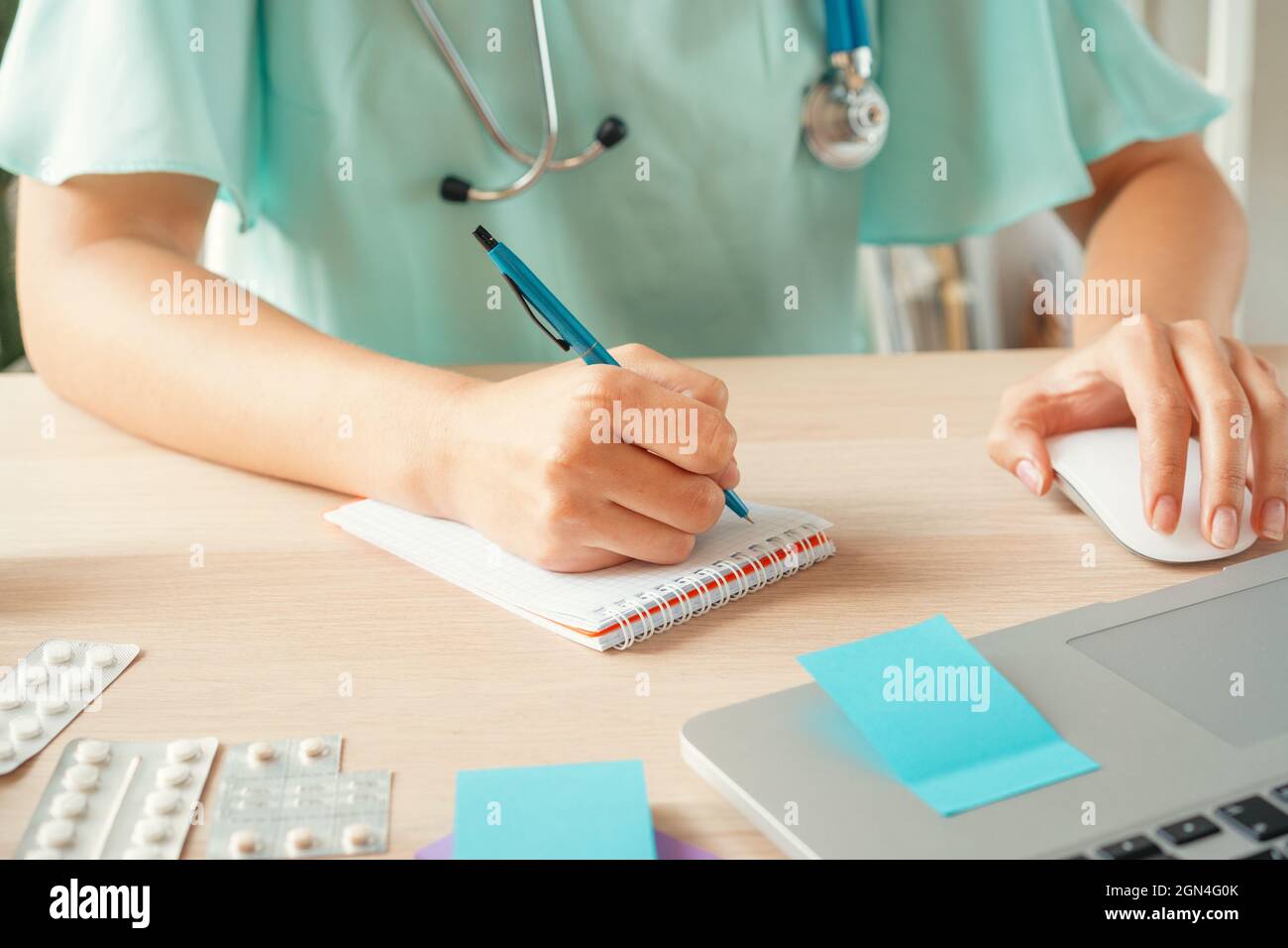 Female medicine doctor filling patient medical form or prescription ...