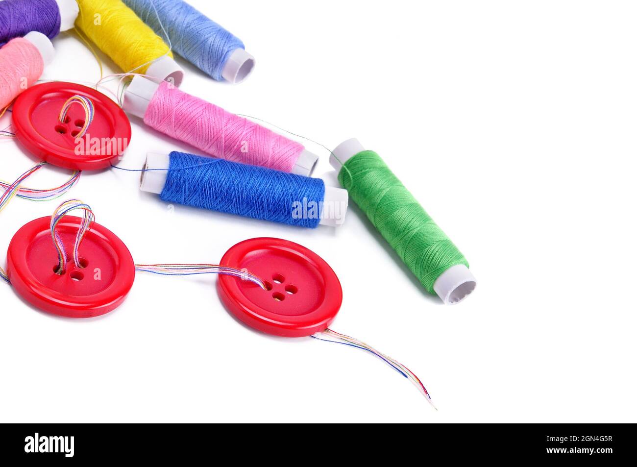 Sewing thread and buttons isolated on white background. Flat lay, top ...