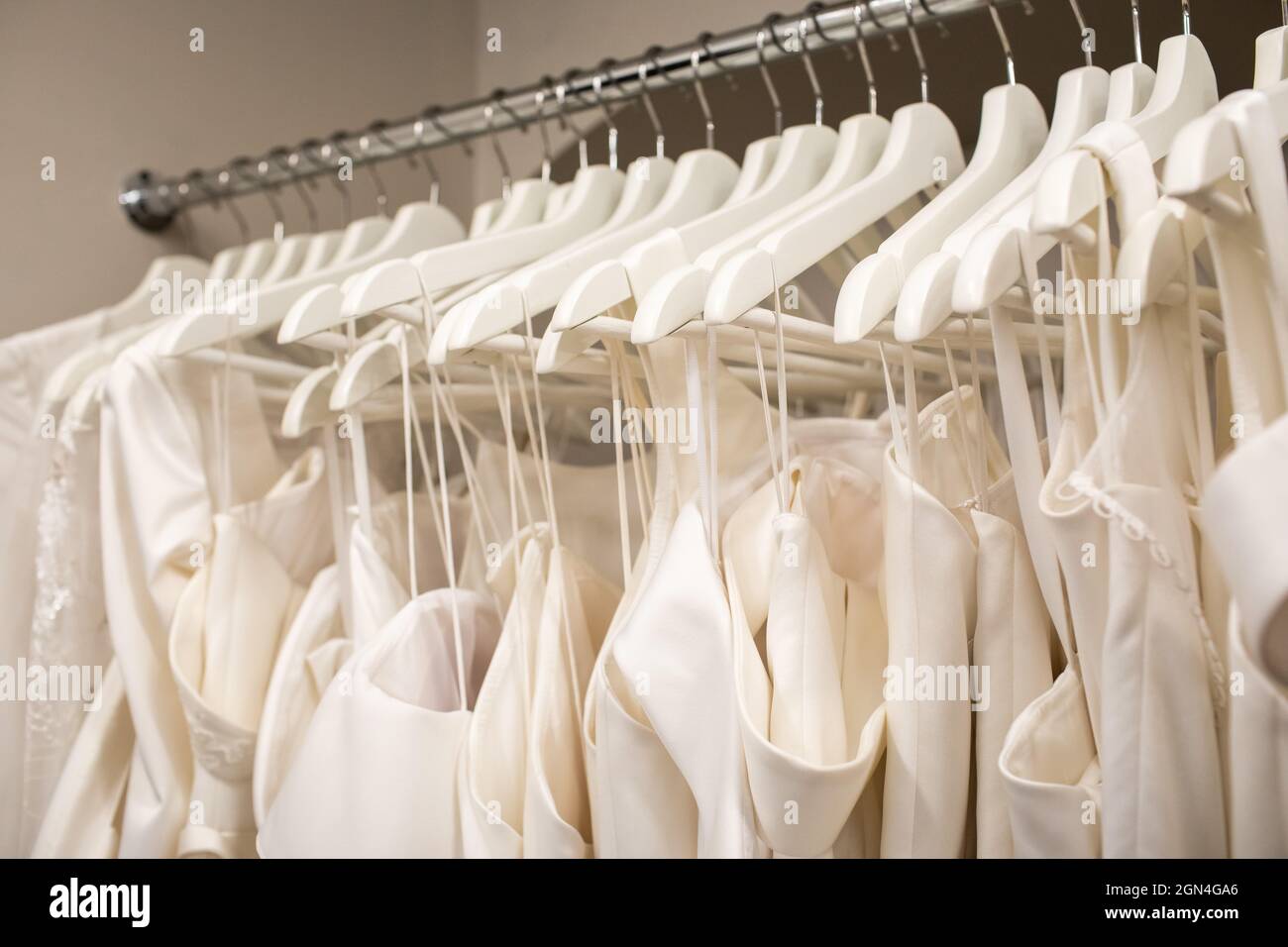 Wedding dresses hanging on a hanger. Fashion look. Interior of bridal ...