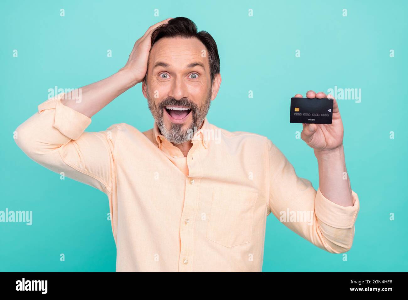 Photo of happy excited amazed surprised male hold credit debit card ...