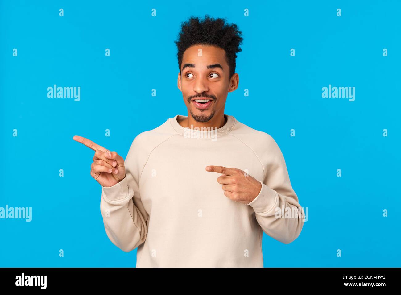 What is that. Curious and amused good-looking african american young ...