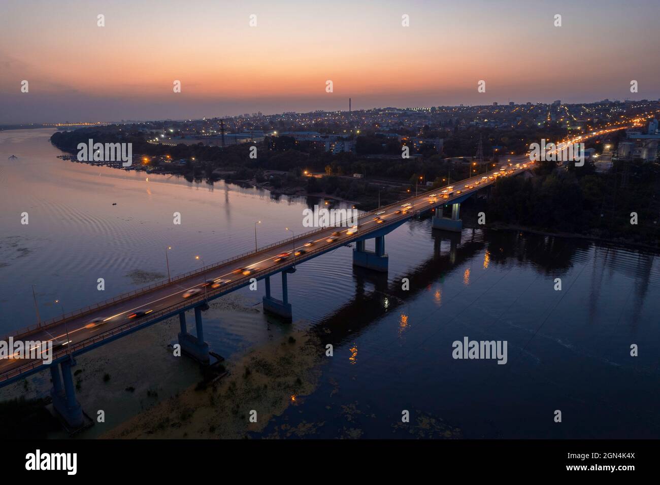 Old bridge city river near city at night Stock Photo - Alamy