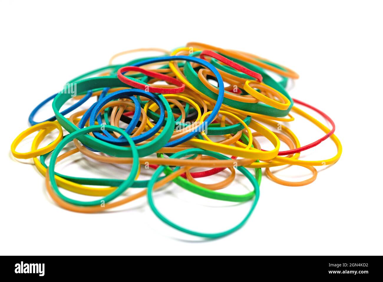 Many colorful rubber rings against a white background Stock Photo - Alamy