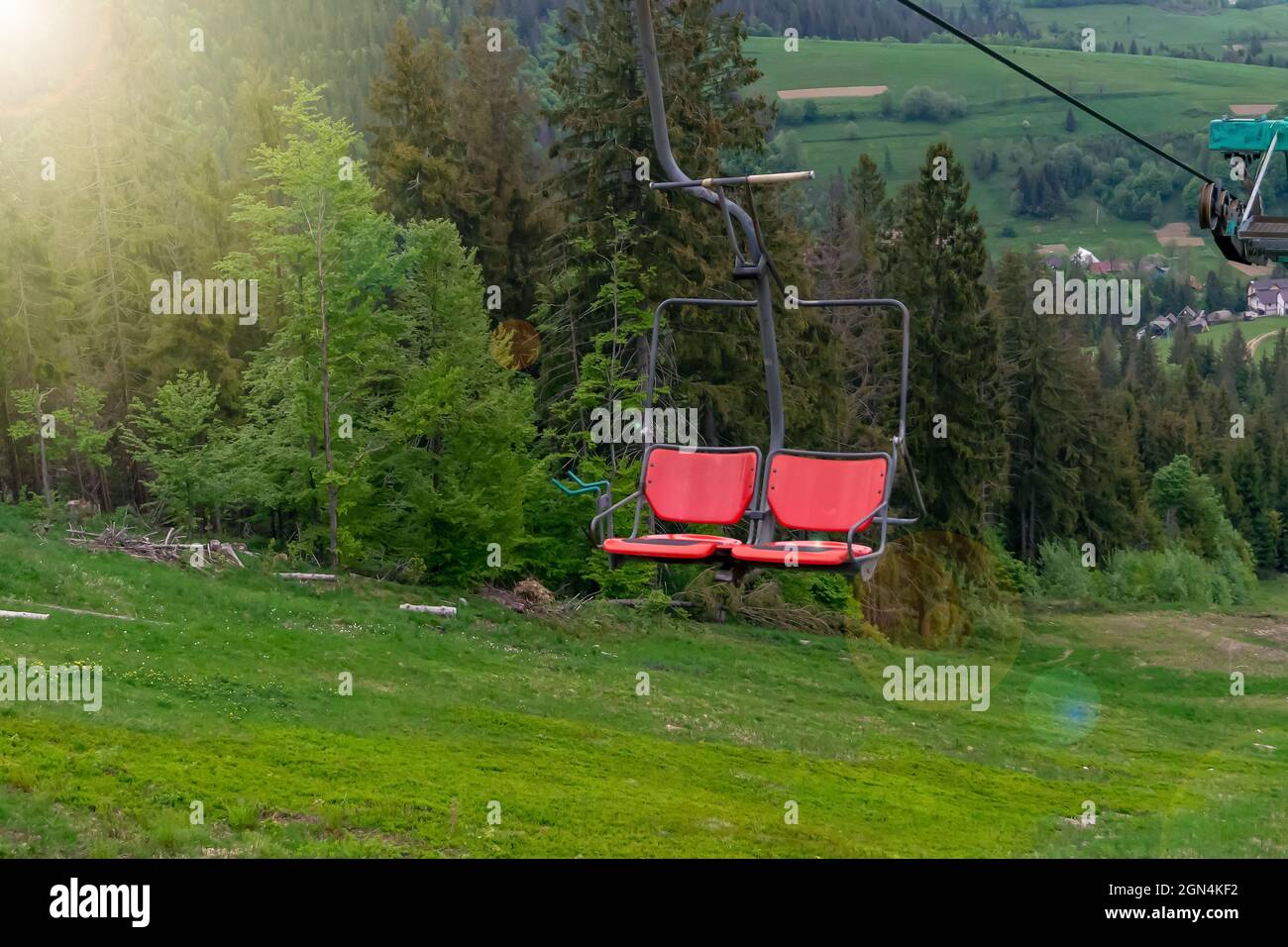 chair lift in a ski resort. Lift in the summer season. Moving rope and ...