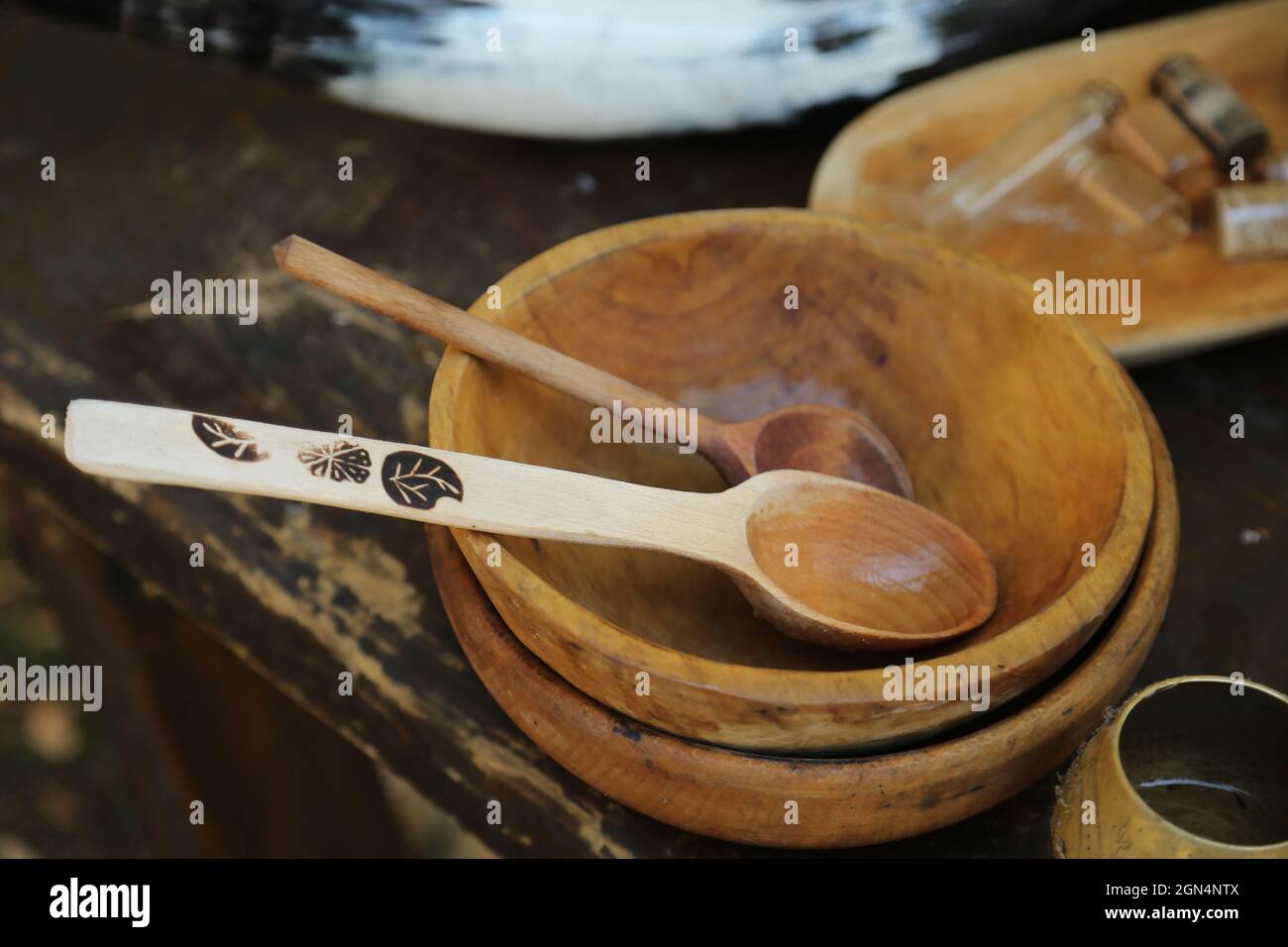 Closeup of the traditional wooden bowls with spoons Stock Photo - Alamy