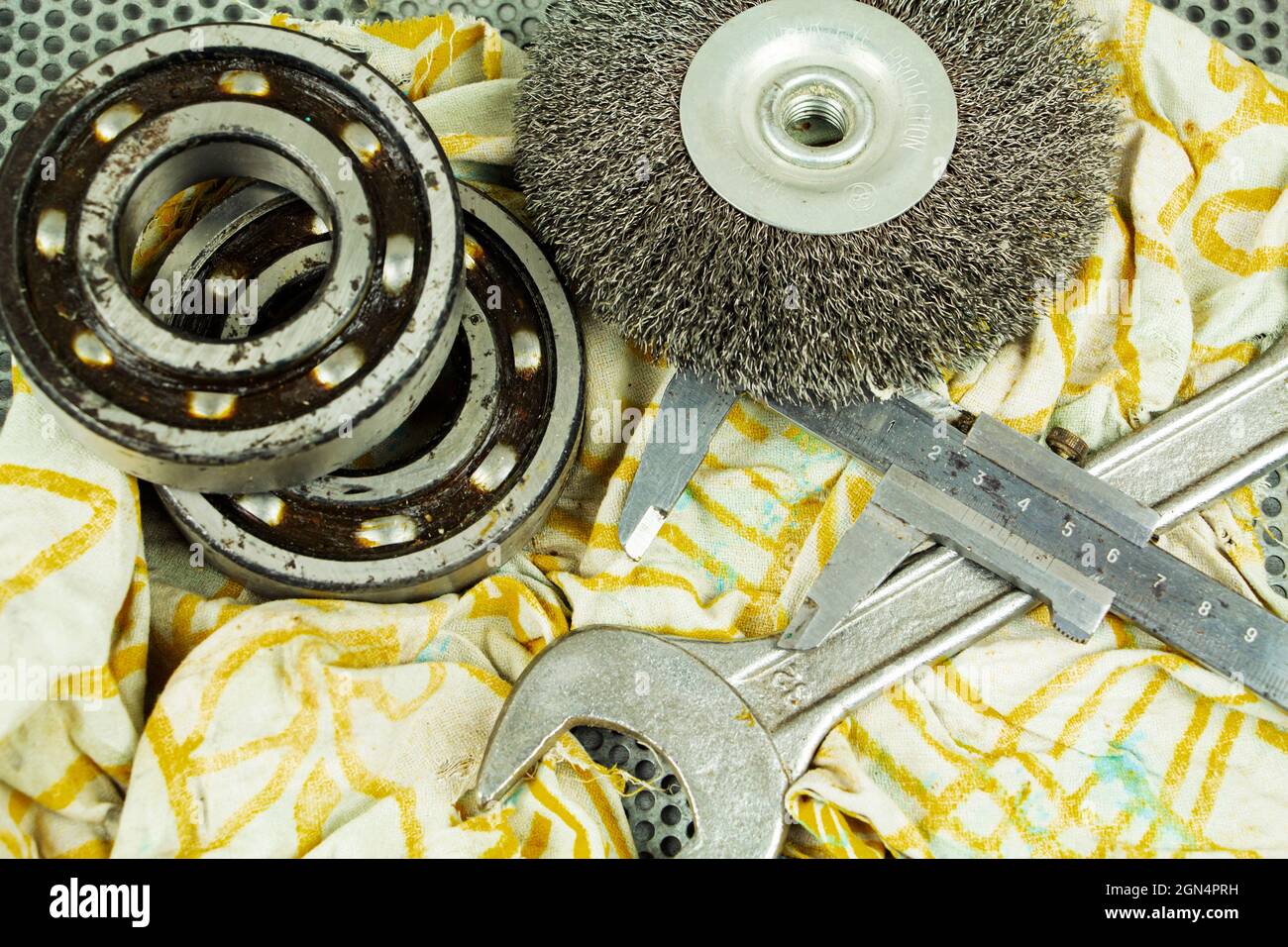 Metalworking tools, steel parts, a wrench, on the background of a metal ...