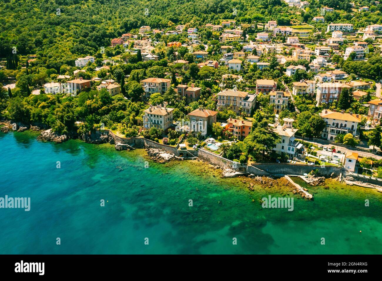 Beautiful villas near the coast of rocky beach in a small town Lovran ...
