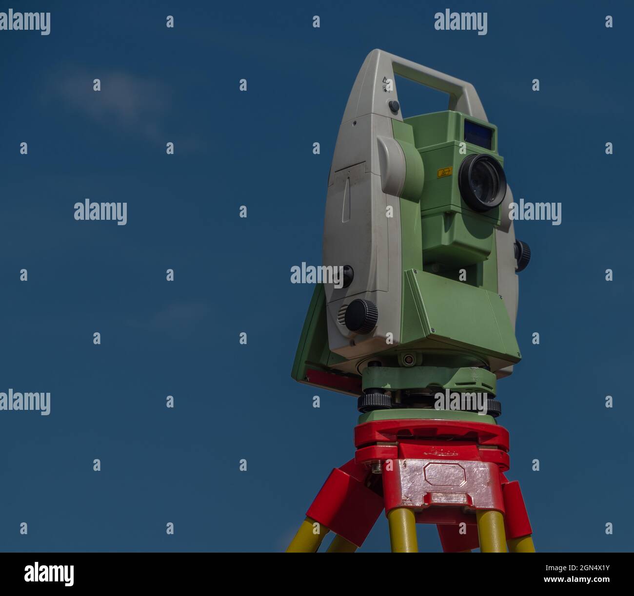 Machine for surveyors with blue sky and green trees in sunny color day ...
