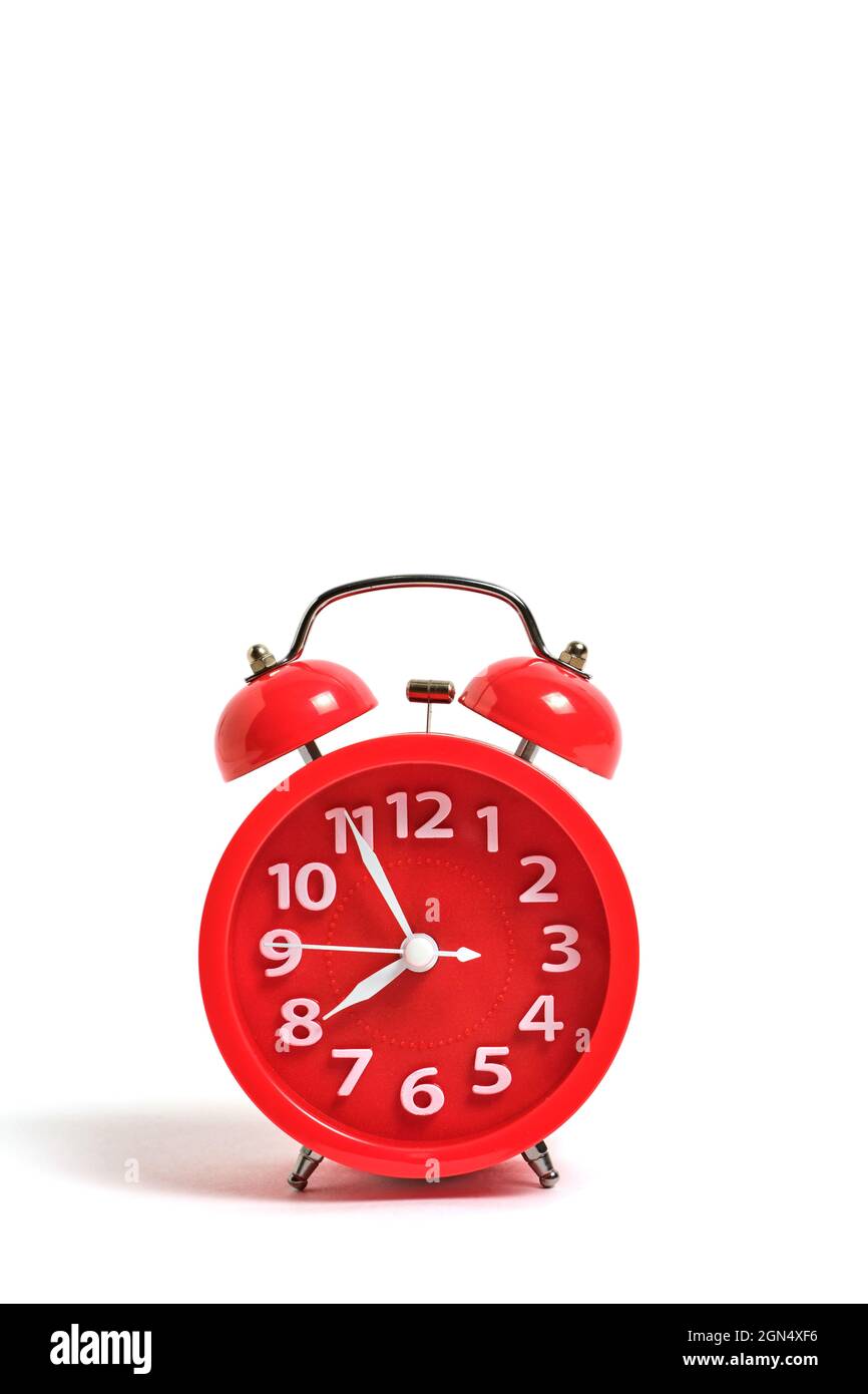 Red alarm clock isolated on white background shows 7 hours 55 minutes ...
